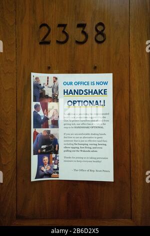 A sign hangs on a door of an office on Capitol Hill in Washington ...