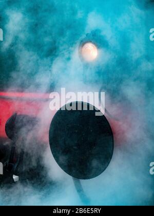 Closeup of a steam engine buffer wreathed in steam Stock Photo - Alamy