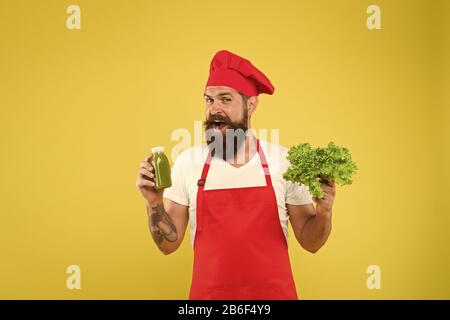 Fresh juice. Squeezing smoothie. Man bearded chef hold organic natural ...