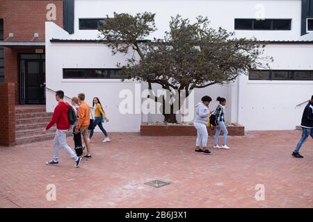 secondary school students walking outside school in playground Stock ...
