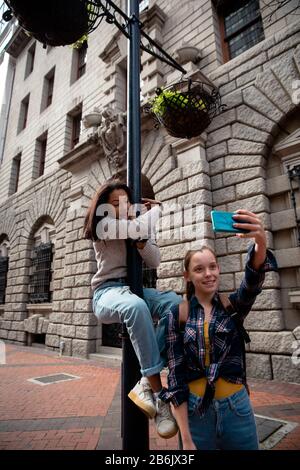 Girl taking selfies in spring park Stock Photo - Alamy