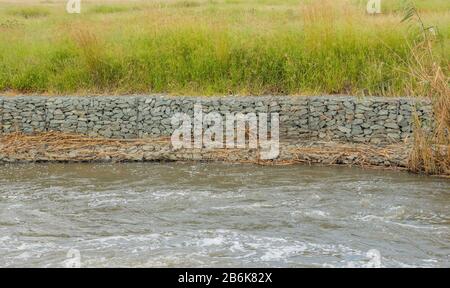Gabion retaining walls to control erosion and flooding on the banks of ...