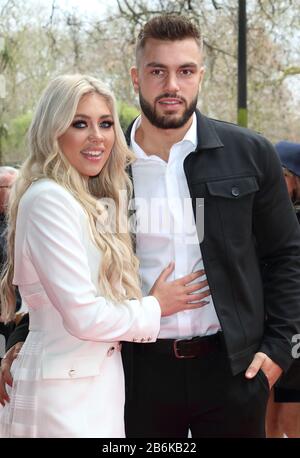 Paige Turley and Finlay Tapp attend the TRIC Awards 2020 held at the ...