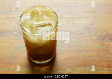 ice coffee topping milk floating with straw in glass Stock Photo - Alamy