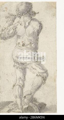 Flute player with his right foot on a helmet, seen from the back ...