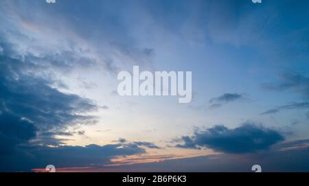 Beautiful sky with stretched clouds during twilight Stock Photo - Alamy