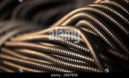 Close-up of a huge bundle of metal flexible tubes interconnected in ...