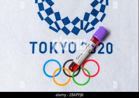 March 11, 2020, Tokyo, Japan: A woman wearing a face mask prays during ...