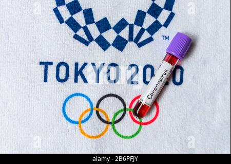 March 11, 2020, Tokyo, Japan: A woman wearing a face mask prays during ...