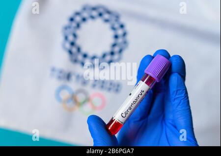 March 11, 2020, Tokyo, Japan: A woman wearing a face mask prays during ...