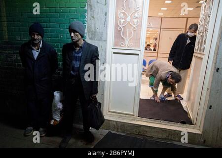 Homeless men sleep on an E line subway train in New York on Sunday ...