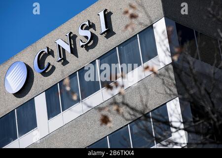 A logo sign outside of the headquarters of CNSI in Rockville, Maryland ...