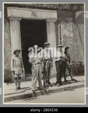 Joris Ivens, John Fernhout and Robert Capa with weapons posing between ...