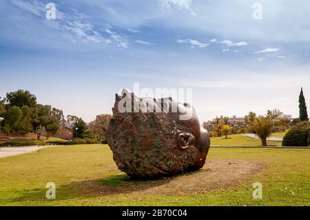 sculpture head facing up in the park - detail Stock Photo - Alamy