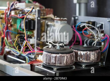 Assembled circuit of electrical relay inside metal case on steel frame ...