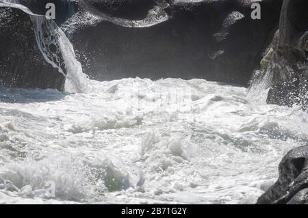 Frothy surf at Muriwai beach on New Zealand's north island Stock Photo ...