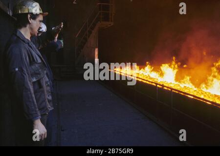 Burning coke falls from the coke oven into the fire engine at the ...
