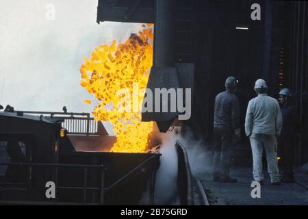 Burning coke falls from the coke oven into the fire engine at the ...