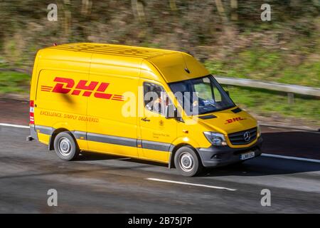 DHL delivery man driving yellow Mercedes Sprinter M6, Lancaster, UK ...
