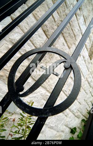 Iron gate emblazoned with the letter "F Stock Photo - Alamy
