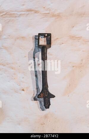 old iron pickaxe hanging on top Stock Photo - Alamy