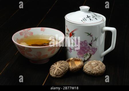 Shiitake tea in bowl, teapot and shiitake mushrooms, Germany Stock ...