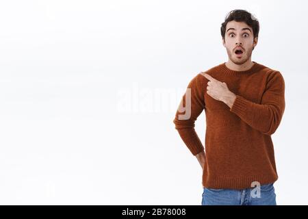 Portrait of impressed guy look open mouth amazing message isolated over ...