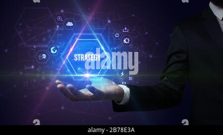 Man hand holding STRATEGY inscription, social media concept Stock Photo ...