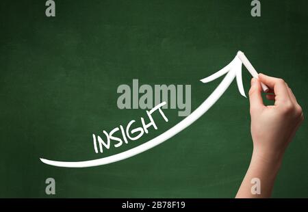 Hand drawing INSIGHT inscription with white chalk on blackboard ...