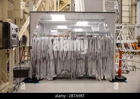 Containment suits are seen at Nasa where they unveiled the Orion Space ...