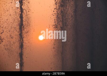 The sun sets behind a water fountain in front of the Museum of Islamic ...