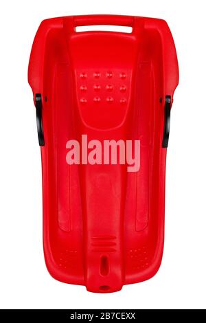 Plastic red sled for skiing on white background Stock Photo - Alamy