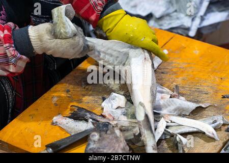 Peeling off the fish skin Stock Photo - Alamy