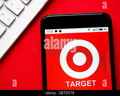 In this photo illustration, a Target logo is displayed on the screen of ...