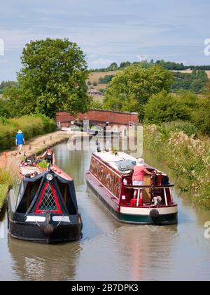 Narrowboat approaching a lock on the Napton Flight of the Oxford Canal ...