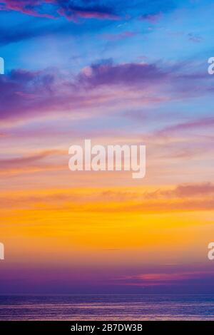 People enjoy the beautiful sunset at the Greeting to the Sun. Monument ...