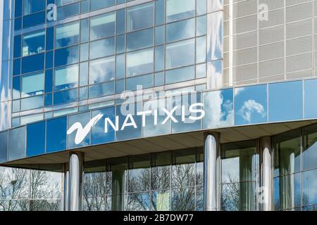 Modern glass office building of Natixis in Paris at dusk sunset, France ...