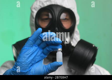 Man wearing gas mask lab protective gear respirator goggles eye ...