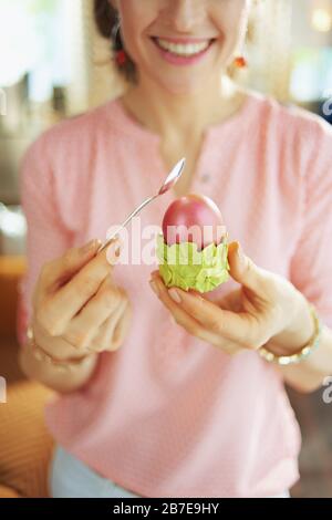 Red chicken eggs on color paper background. Minimalistic Easter concept ...