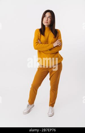 Image of pleased beautiful woman thinking with palms together isolated ...