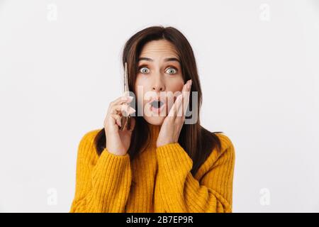 Photo portrait of amazed girl talking on mobile phone laughing wearing ...