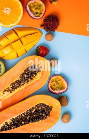 Pattern made of fresh orange halves on blue background. Minimal fruit ...