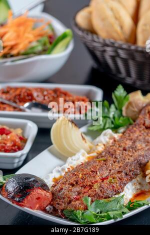 Shish kebab with beer and sauce on a wooden board top view Stock Photo ...