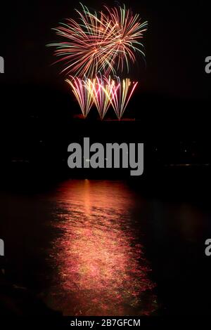 Beautiful multi-colored fireworks against the background of the night ...