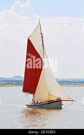 The oyster smack LN32 Mermaid, in full sail Stock Photo - Alamy