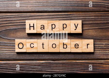 Happy october word written on wood block. Happy october text on table ...