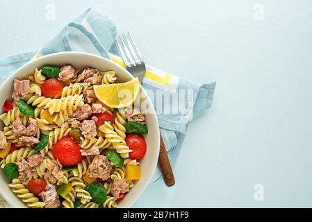 Appetizing pasta salad with tuna and vegetables in a creamy sauce. Top ...