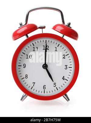 Red alarm clock set at five o'clock on table isolated on white ...