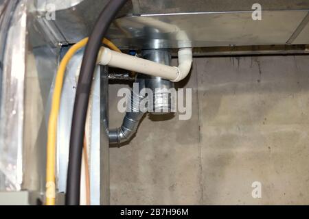 Waste PVC pipe drainage system inside building, piping on the ceiling ...