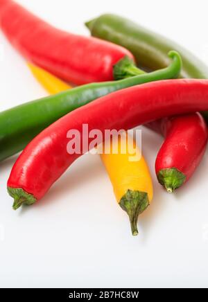 Colorful long sweet peppers on black background Stock Photo - Alamy